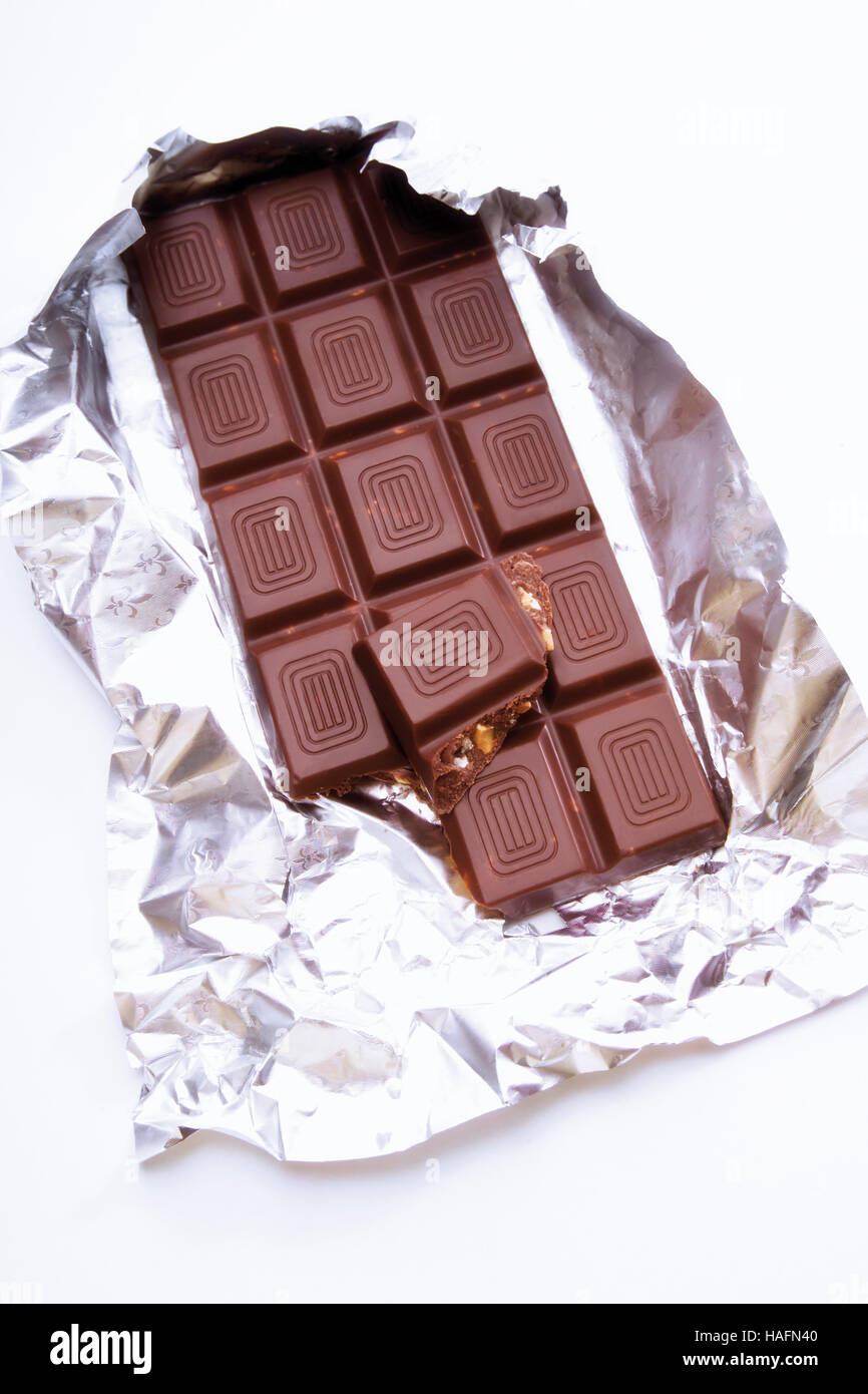 Bar of chocolate in silver paper Stock Photo - Alamy