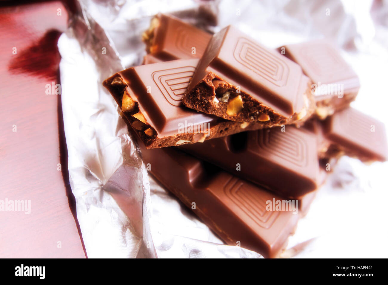 Nut chocolate in silver paper Stock Photo - Alamy