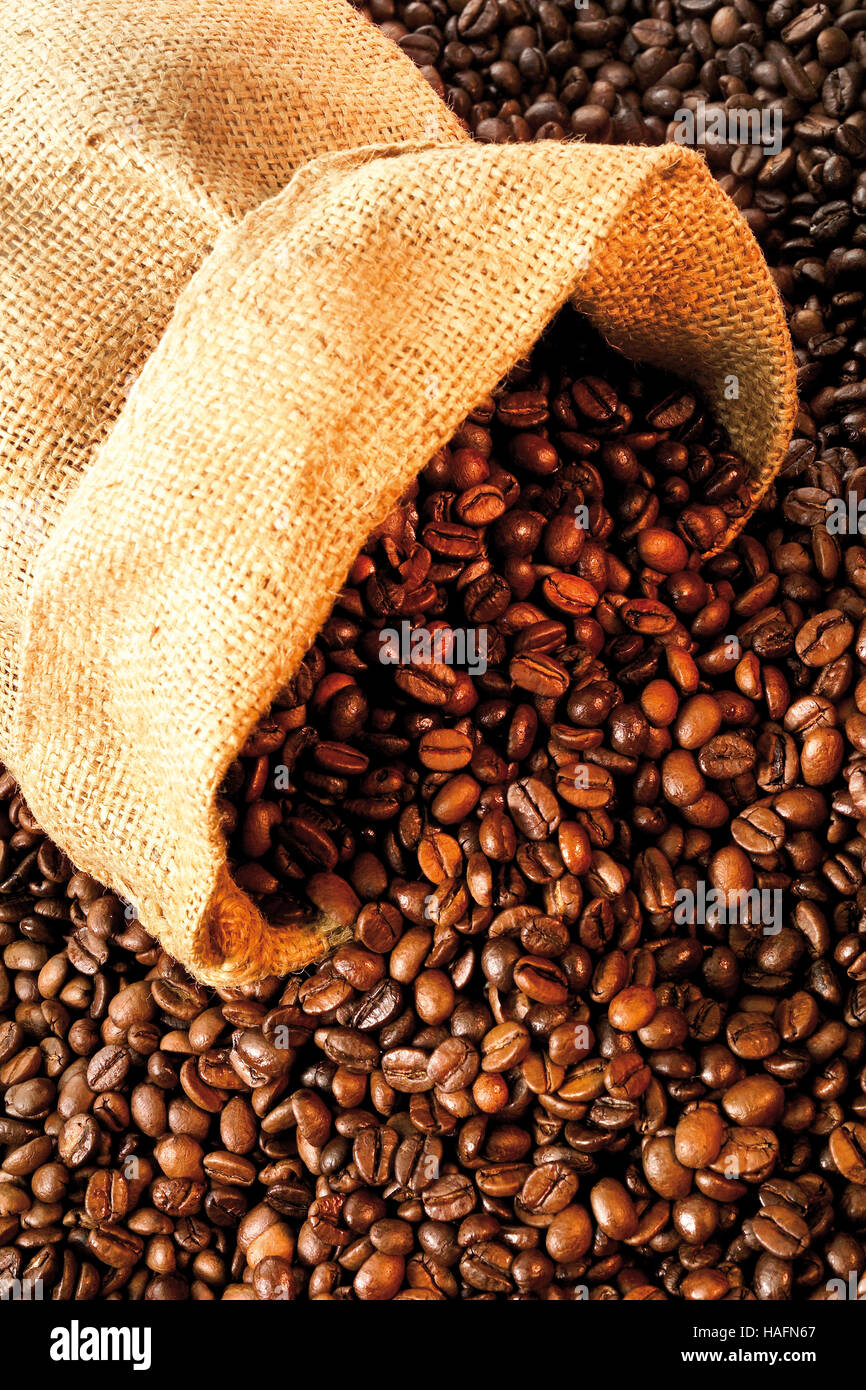 Coffee beans with a linen sack Stock Photo - Alamy