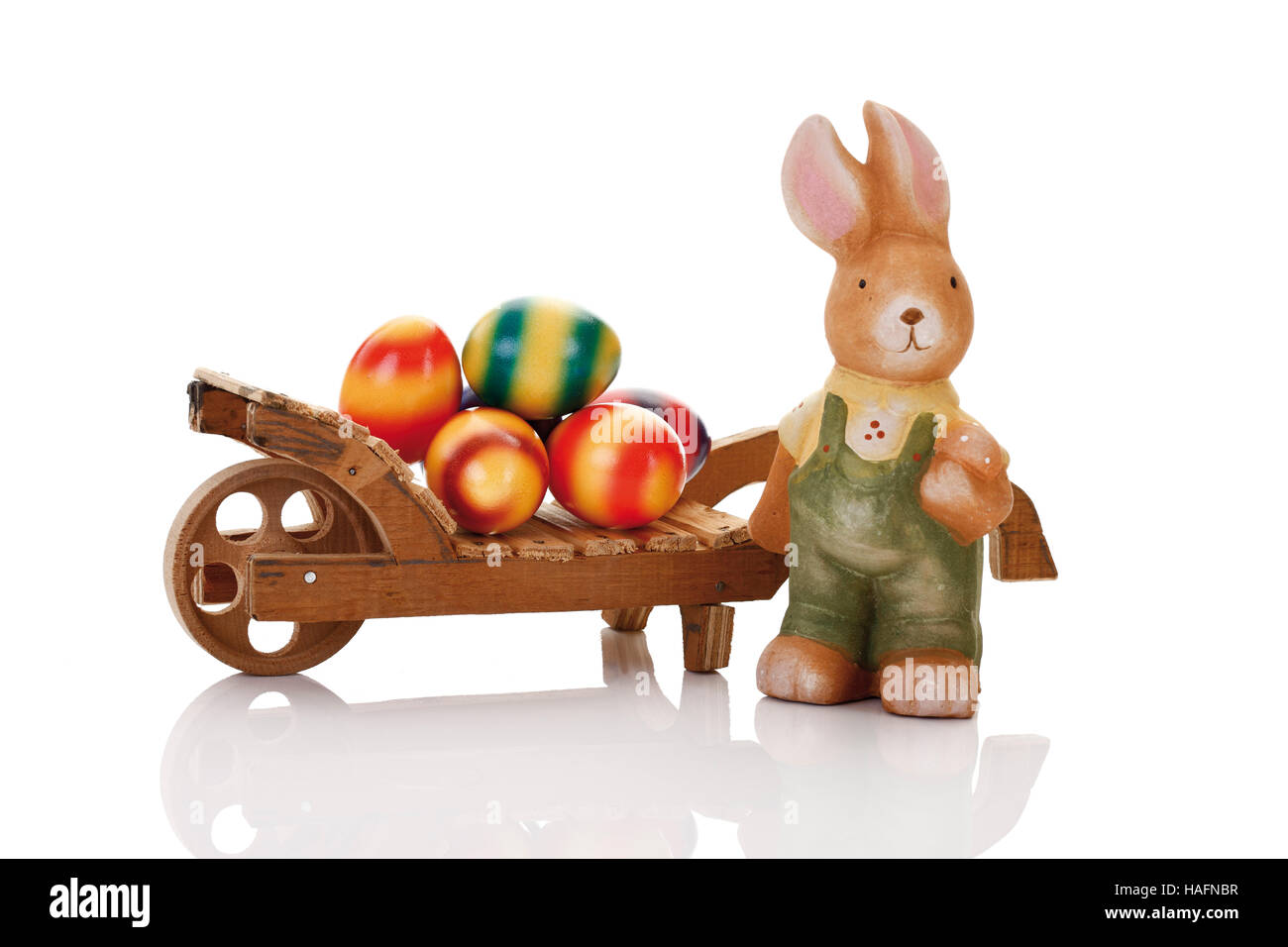 Wheelbarrow with colored easter eggs and ceramic easter bunny Stock ...