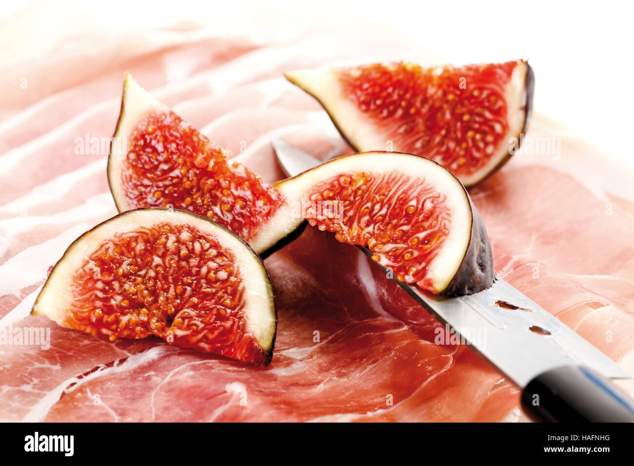Figs (Ficus carica), fresh fruit on raw ham Stock Photo - Alamy