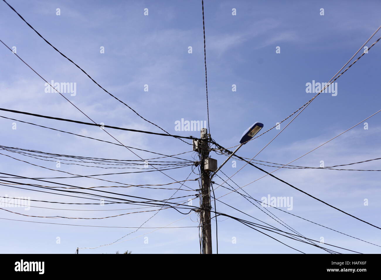 Backlit electricity power lines and pylon Stock Photo - Alamy