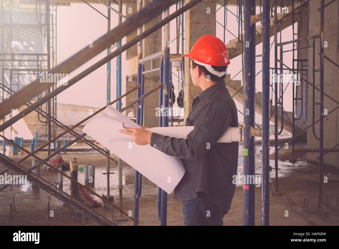 Engineer and Architect working at Construction Site, Vintage Effect ...