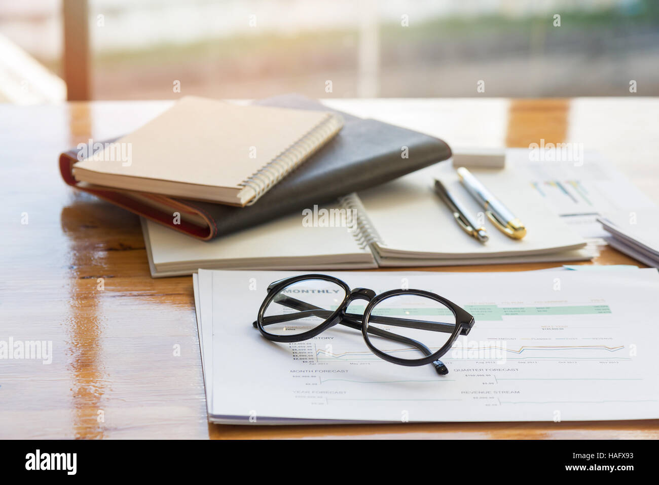 Analysis chart and paperwork on office table Stock Photo - Alamy