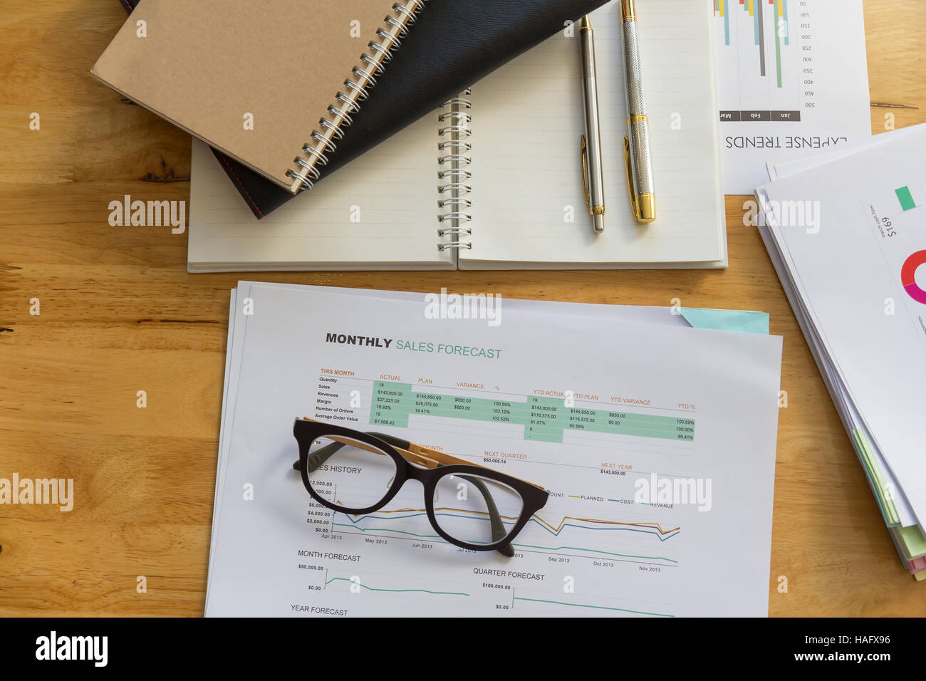 Analysis chart and paperwork on office table Stock Photo - Alamy