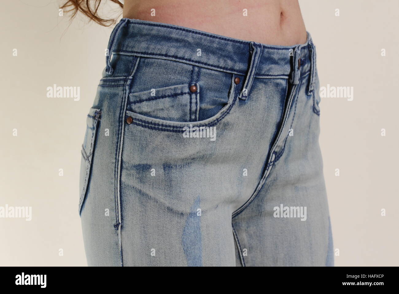 Woman in jeans. Close-up side view of in isolated on white Stock Photo ...