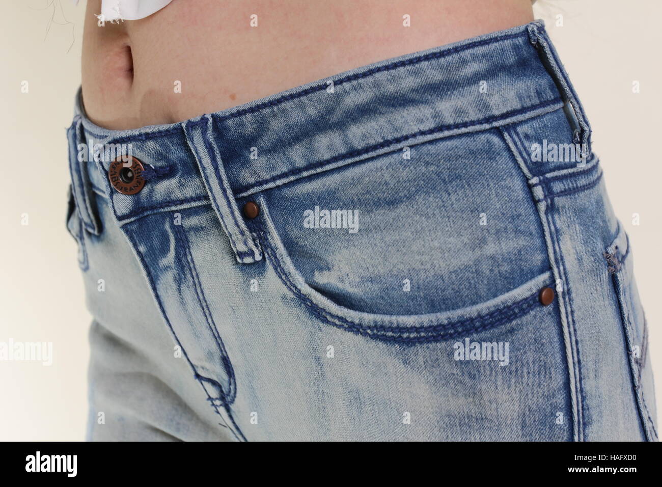 Woman in jeans. Close-up side view of in isolated on white Stock Photo ...