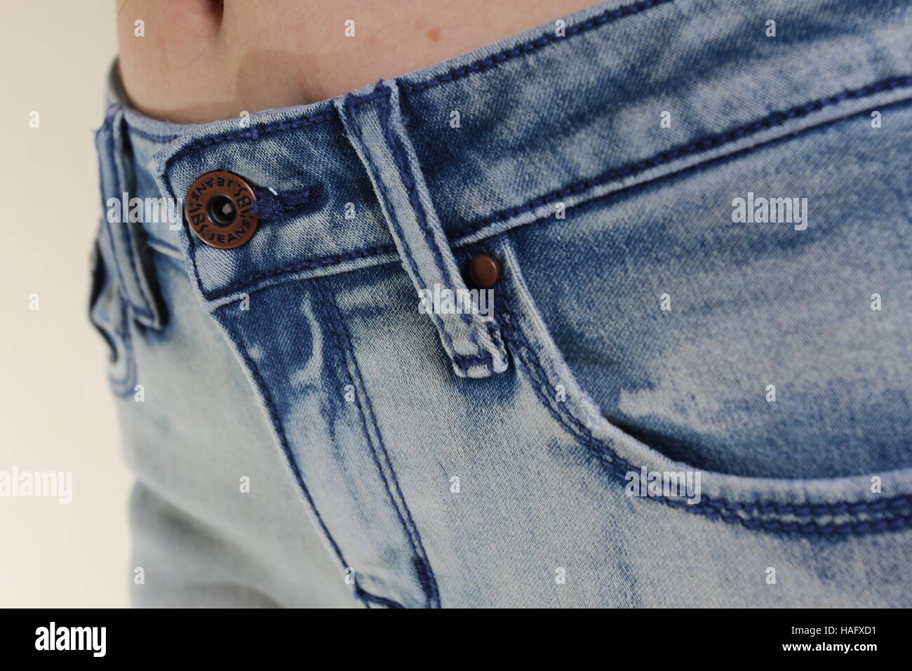 Woman in jeans. Close-up side view of in isolated on white Stock Photo ...