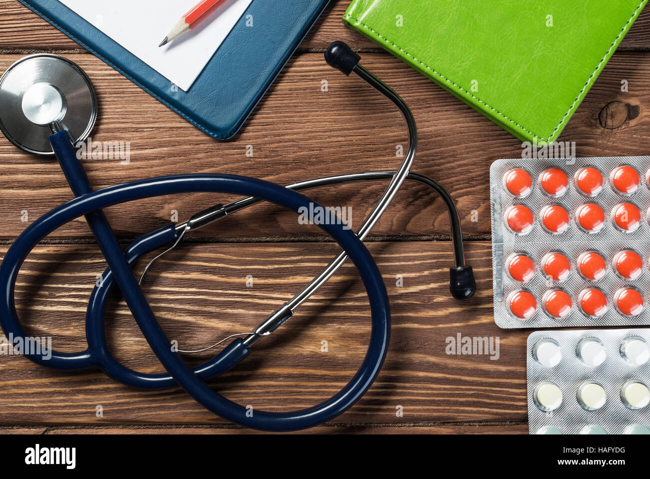 Desk of doctor with medicine things Stock Photo - Alamy