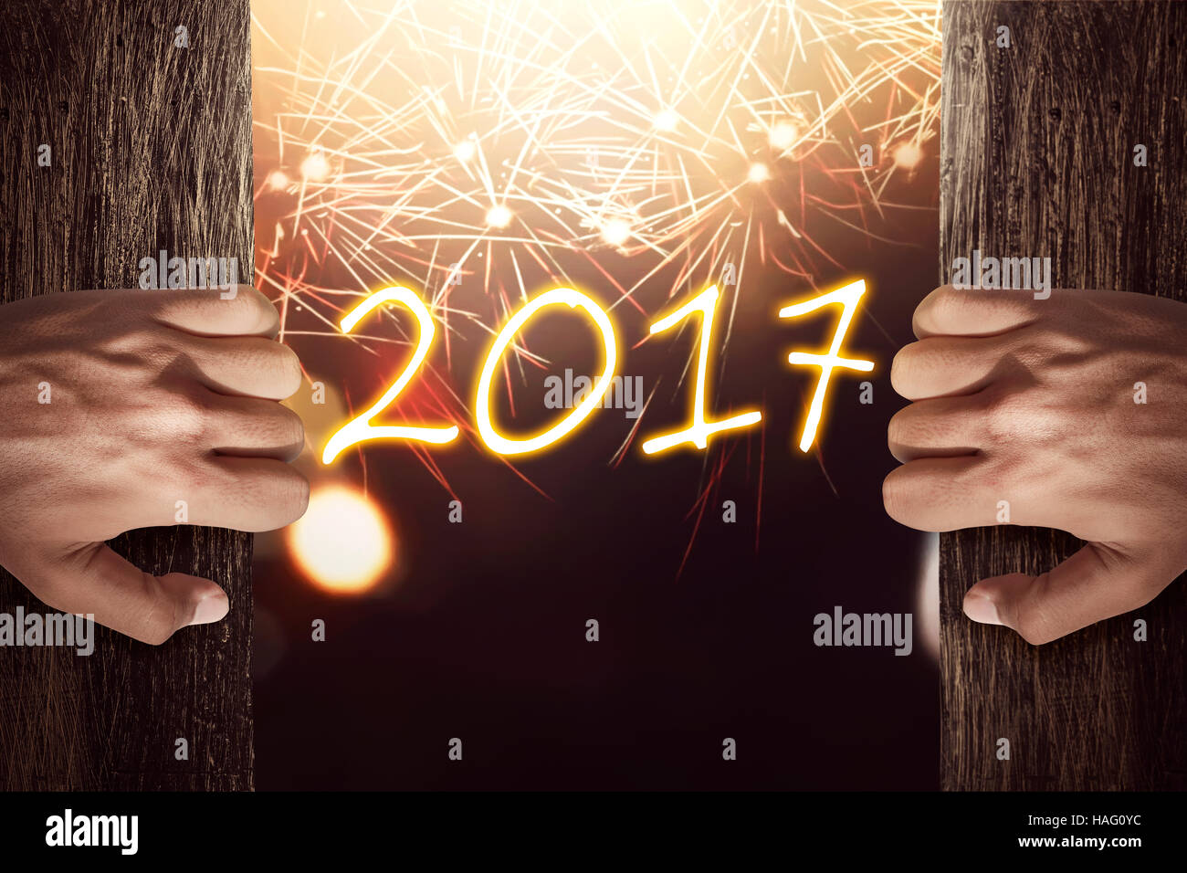 Human hand open door to 2017 night festival Stock Photo - Alamy