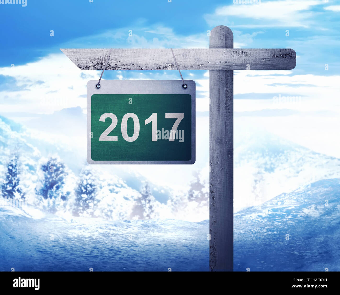 Road sign with number 2017 over blue sky background. Happy new year ...