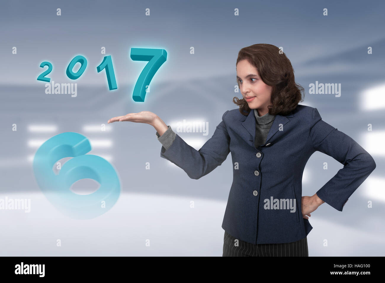 Asian business woman holding 2017 number on her hand Stock Photo - Alamy