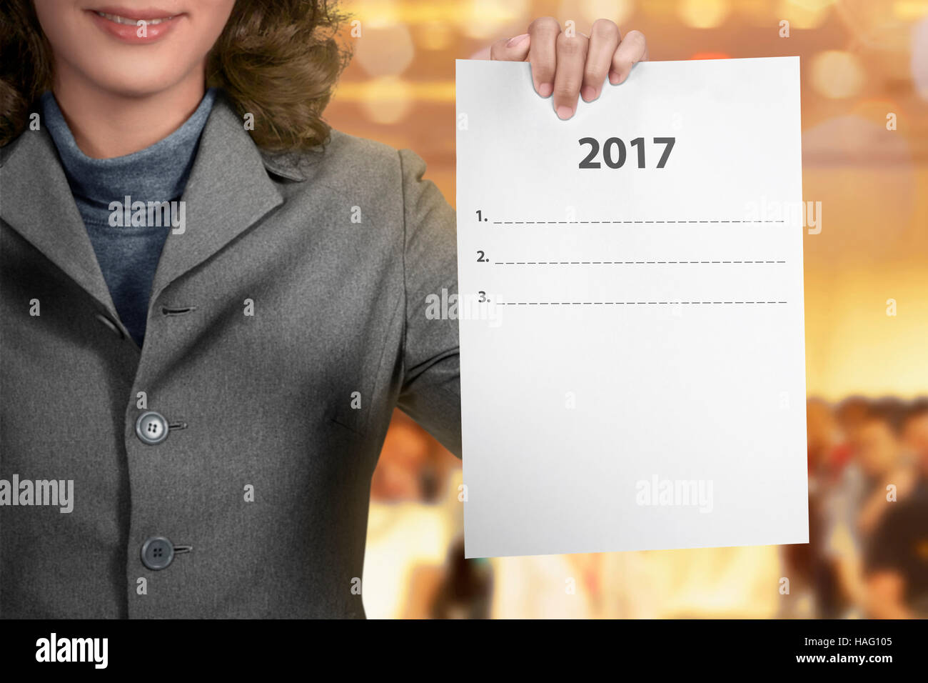 2017 to do list holding by business woman over blur background You can ...