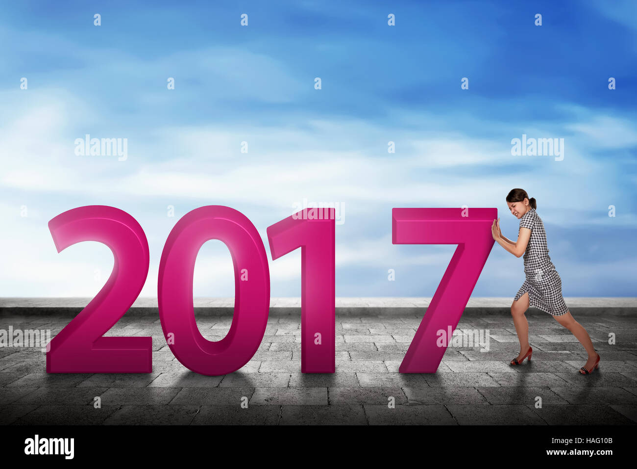 Asian people push 2017 number. Happy new year concept Stock Photo - Alamy