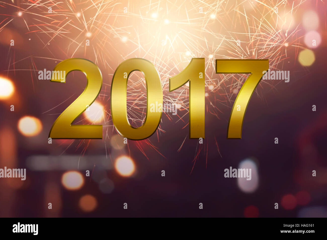 2017 gold numbers with sparkle firework on blurred background Stock ...