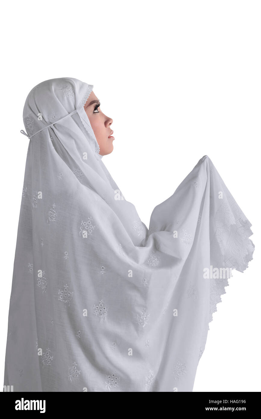 Side of view asian muslim woman wearing veil and pray to god. Isolated ...