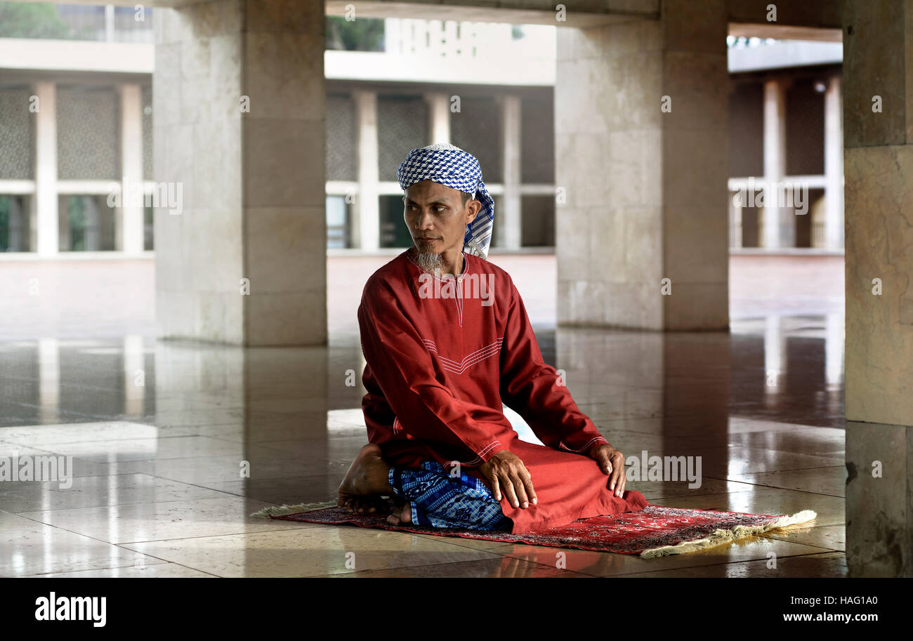 Religious muslim man praying inside the mosque Stock Photo - Alamy