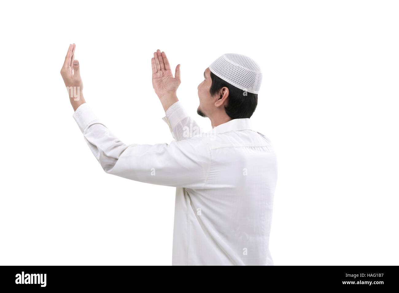 Back view of young muslim man praying isolated over white background ...