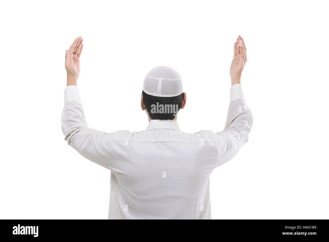 Back view of young muslim man praying isolated over white background ...