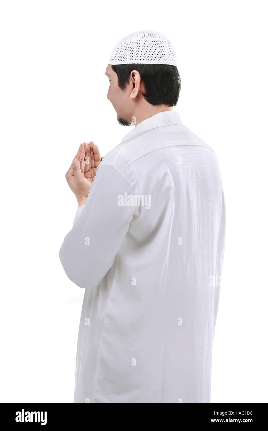 Back view of young muslim man praying isolated over white background ...