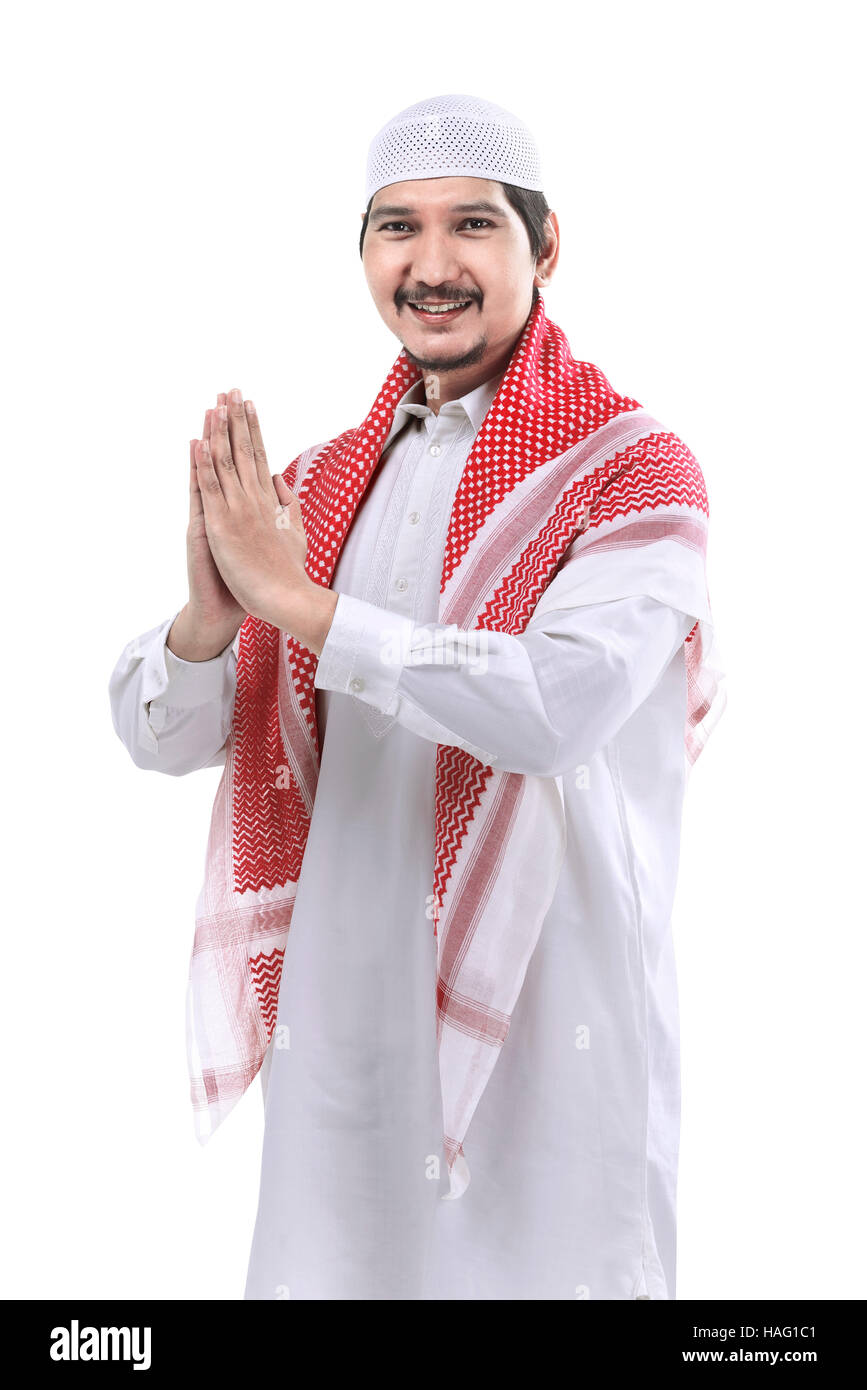 Young muslim man smiling isolated over white background Stock Photo - Alamy