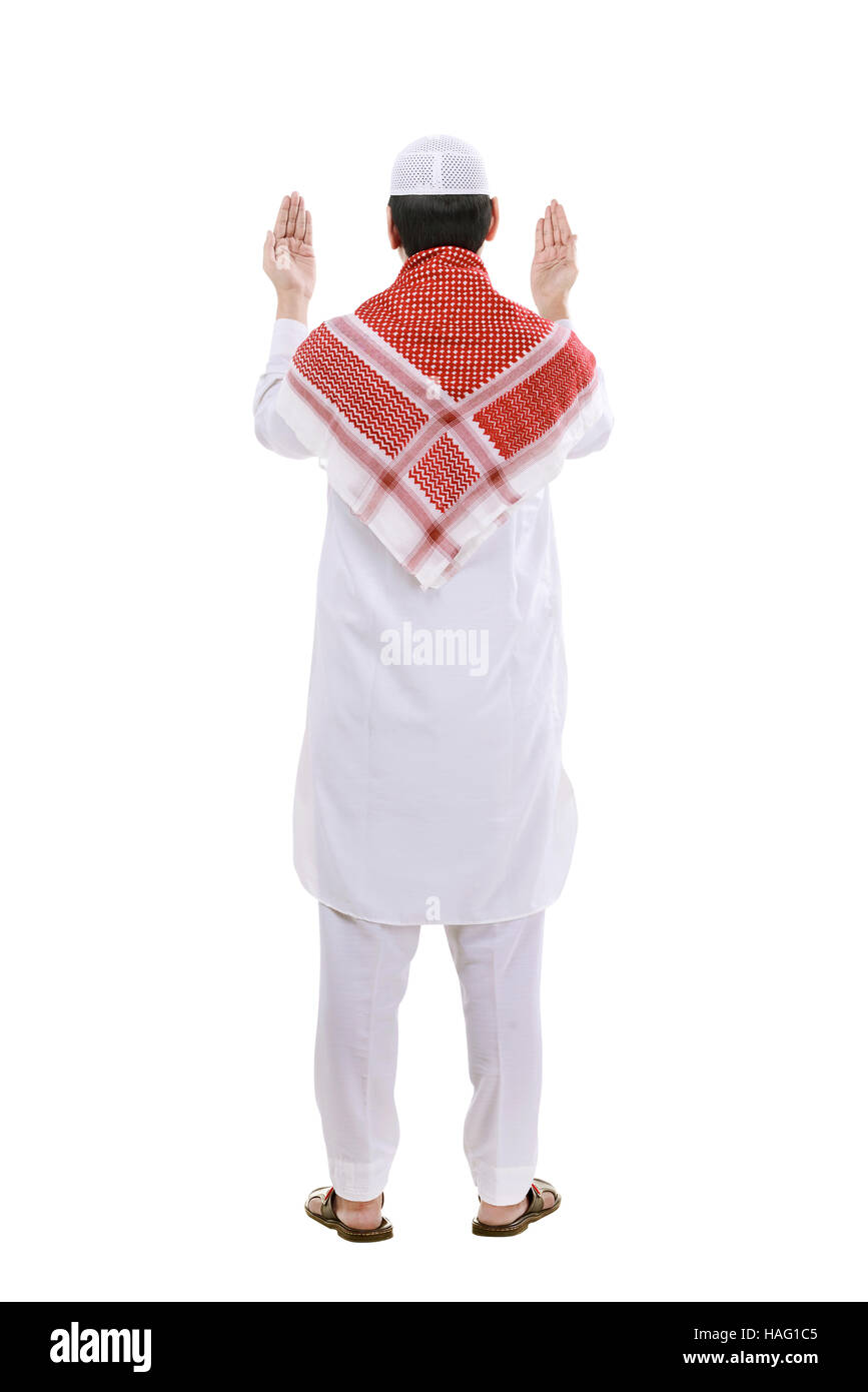 Back view of young muslim man praying isolated over white background ...
