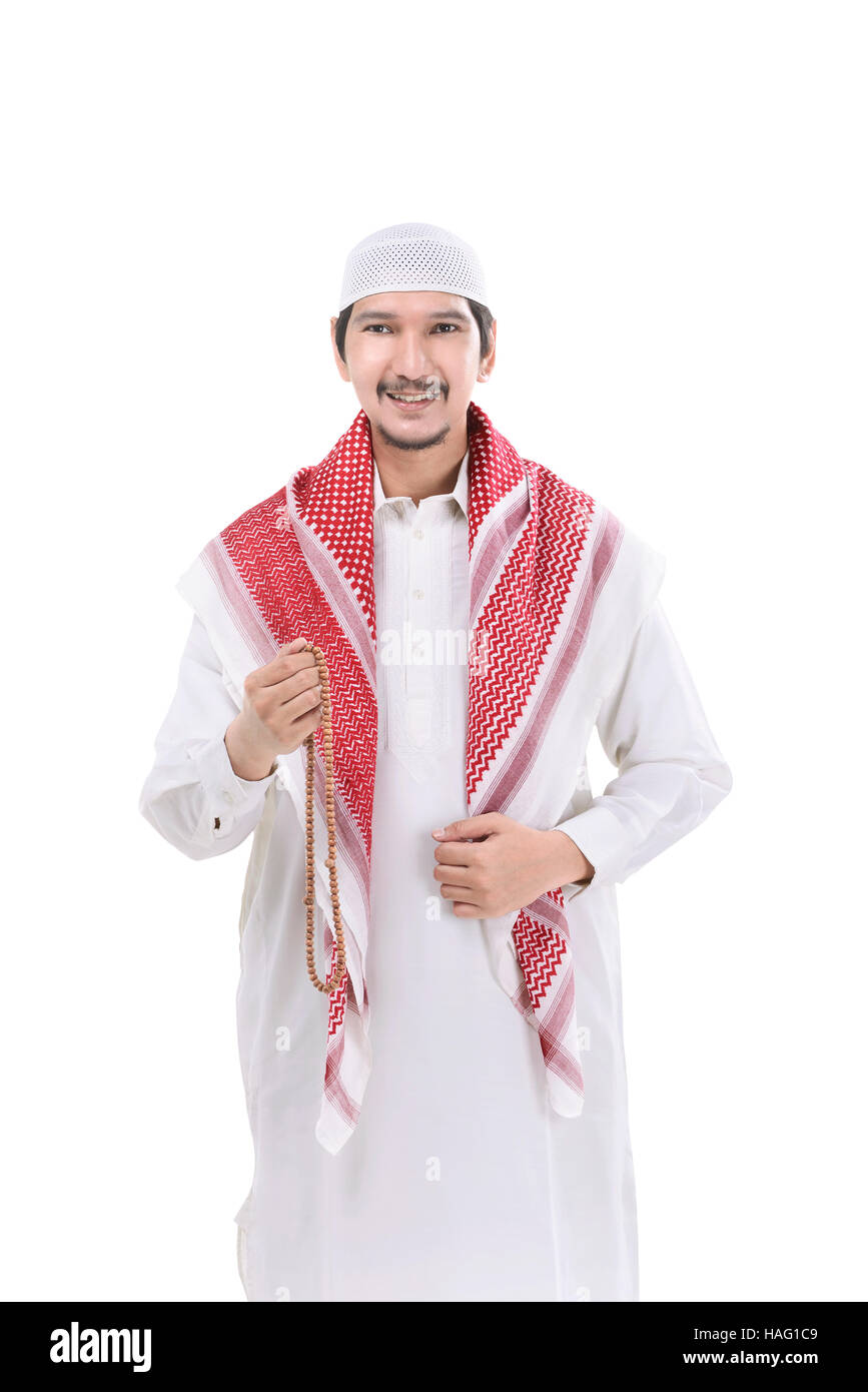 Young muslim man smiling isolated over white background Stock Photo - Alamy Young muslim man smiling isolated over white background Stock Photo - Alamy