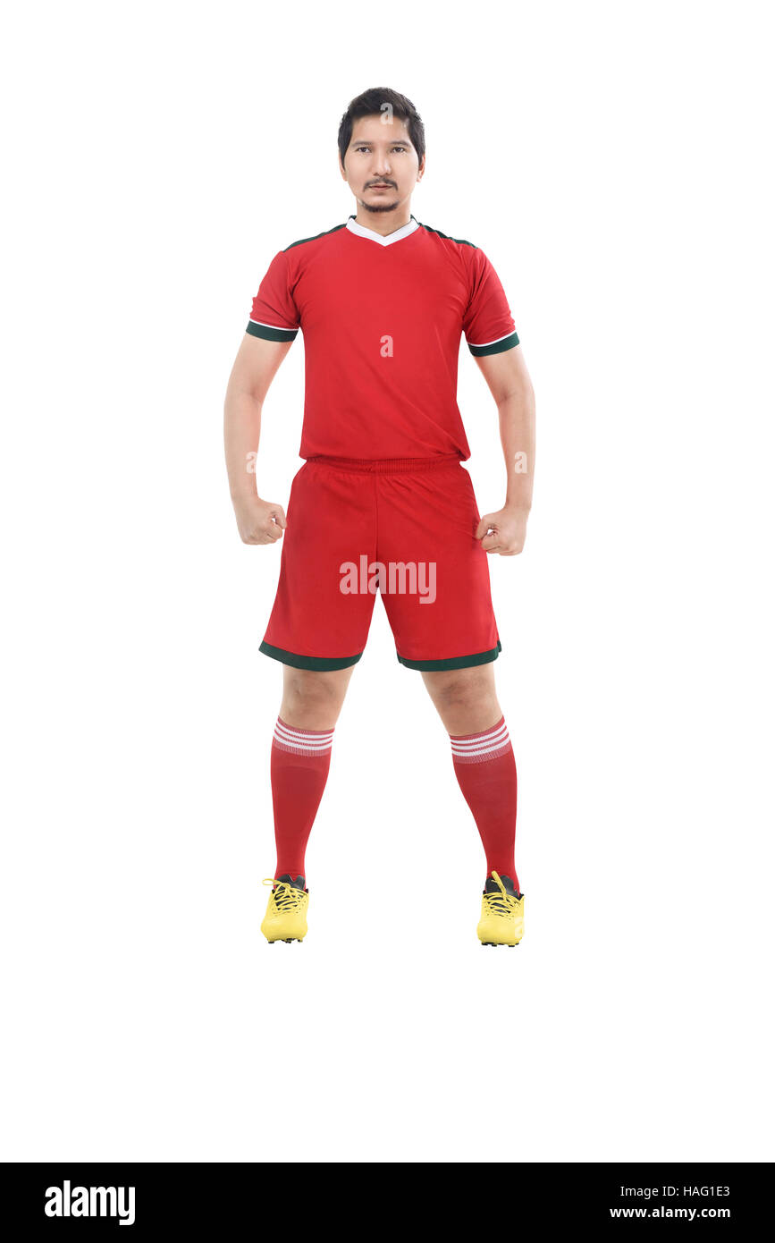 Asian football player standing isolated over white background Stock ...