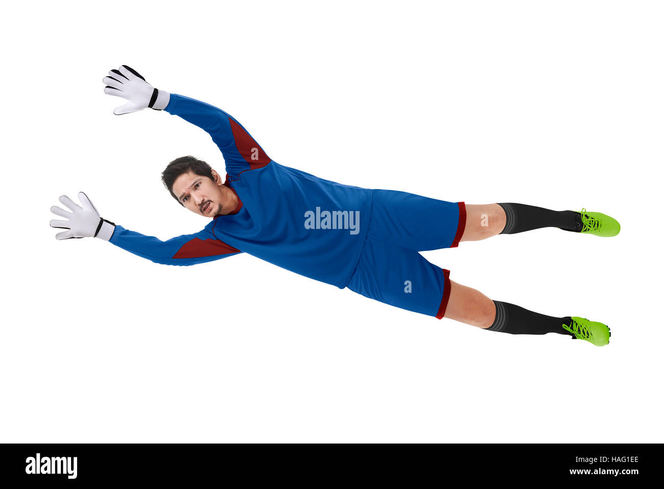 Image of goalkeeper catch ball isolated over white background Stock ...