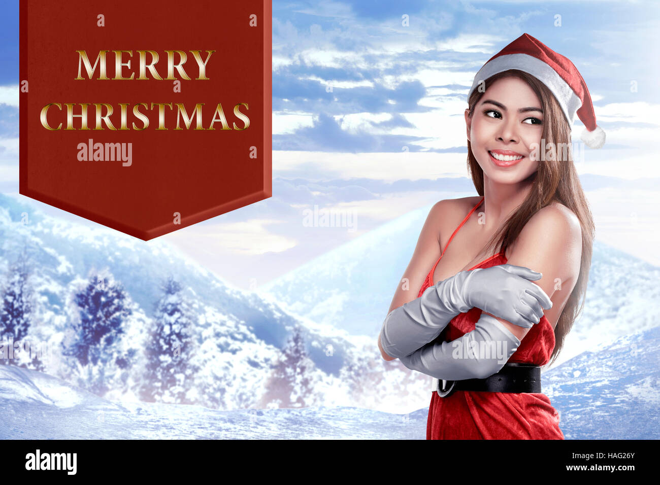Beauty asian santa girl standing beside "Merry Christmas" text on ...