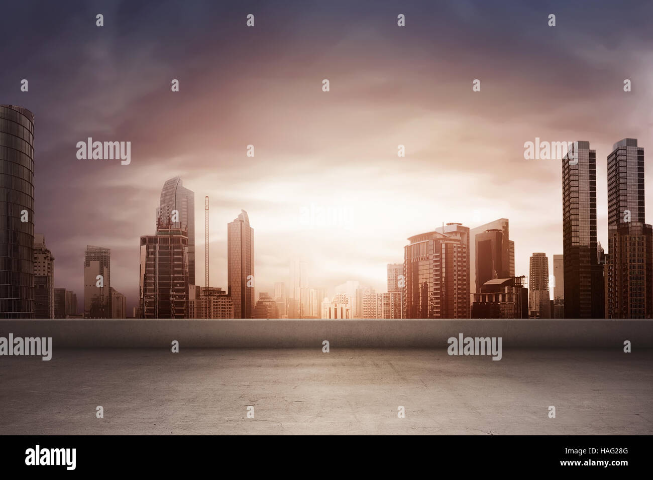 The rising sun shining on the buildings in the modern city Stock Photo ...