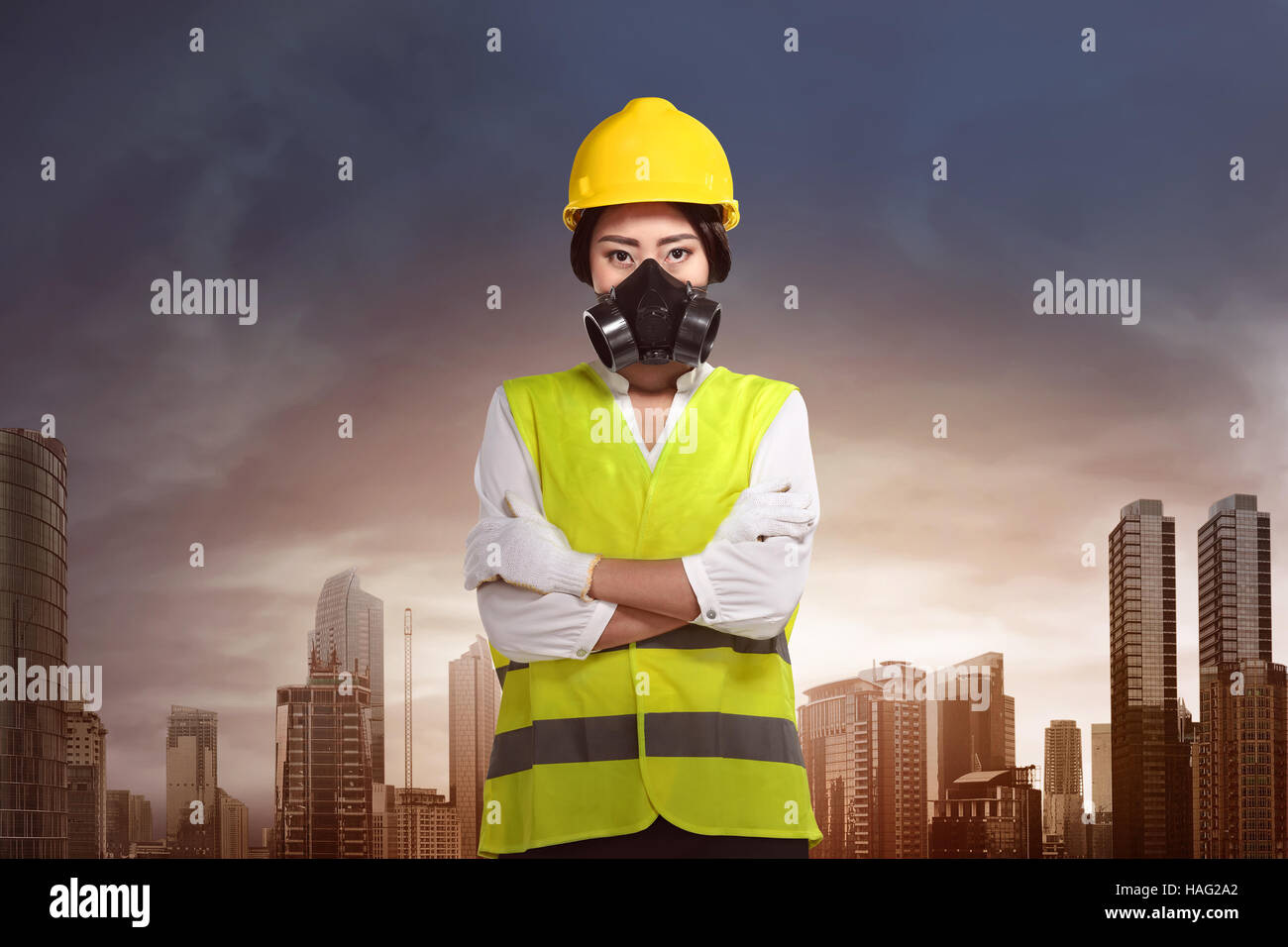 Women contractor, he wearing mask and yellow helmet,to keep safety ...