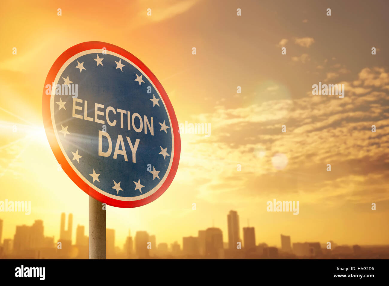 Election day sign with sunset on the city background Stock Photo - Alamy