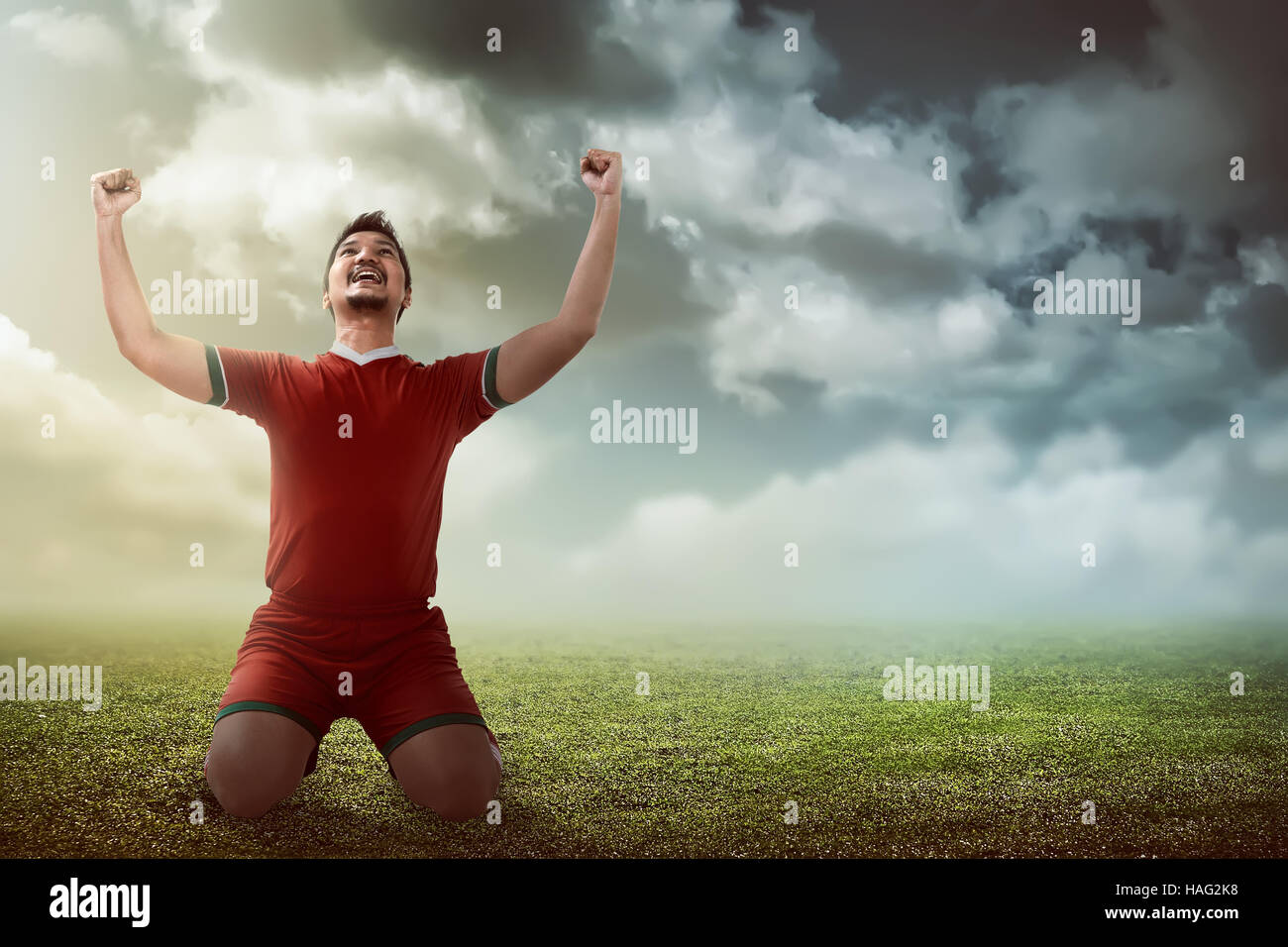 Image of winning football player after score in a match Stock Photo - Alamy