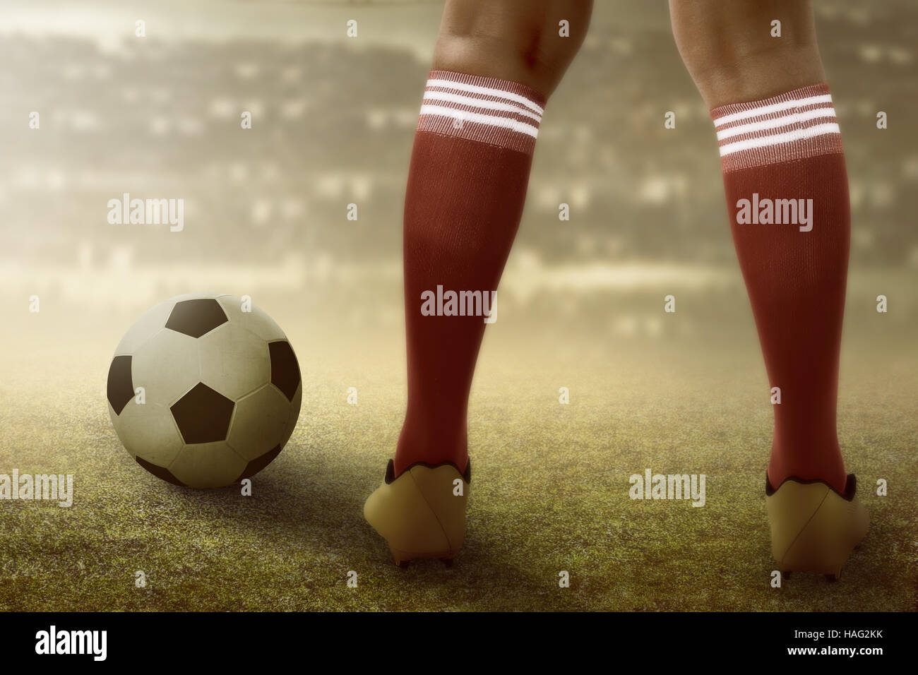 Image of football player feet with ball on the field Stock Photo - Alamy
