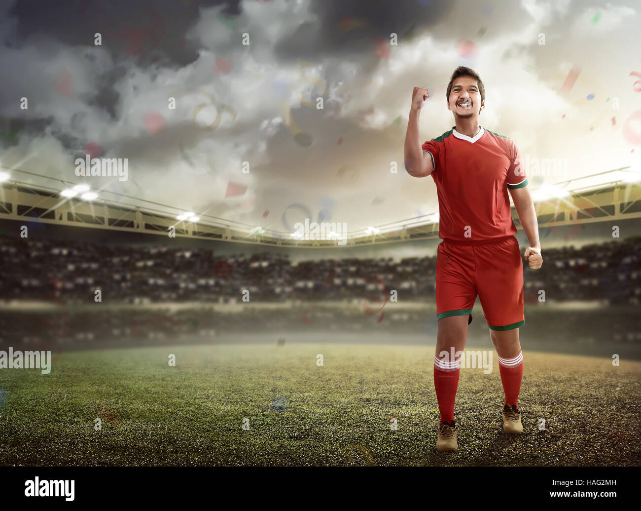 Image of winning football player after score in a match Stock Photo - Alamy