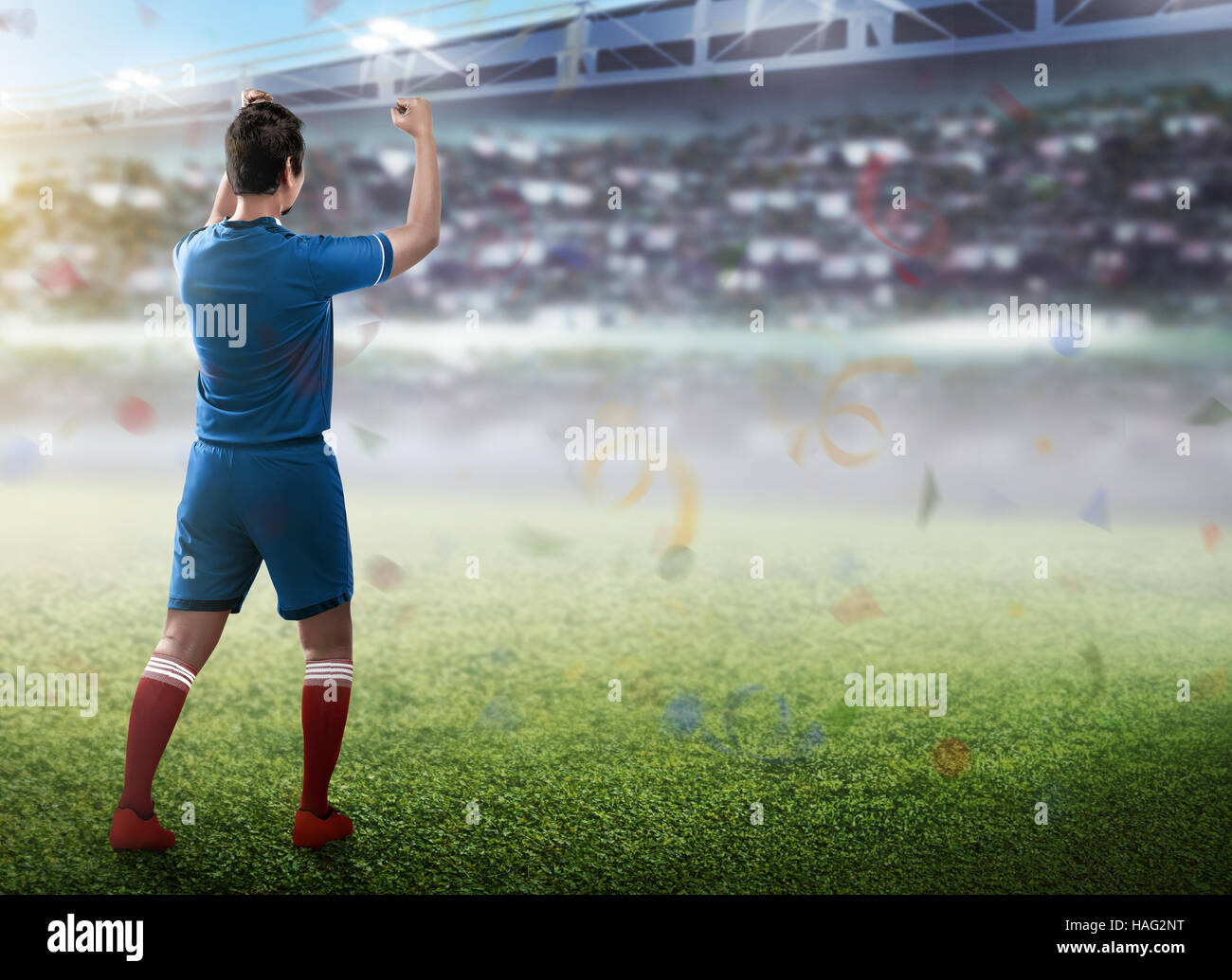 Image of winning football player after score in a match Stock Photo - Alamy