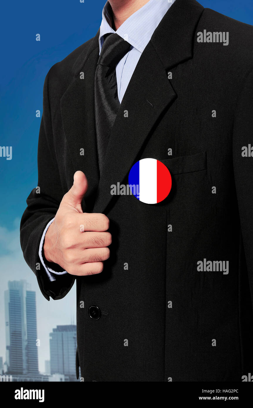 Man show his pin with french flag concept background Stock Photo - Alamy