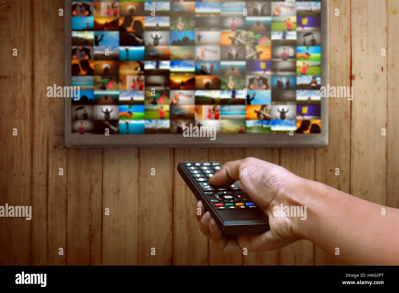 Man choosing channel on the smart tv what to watching Stock Photo - Alamy