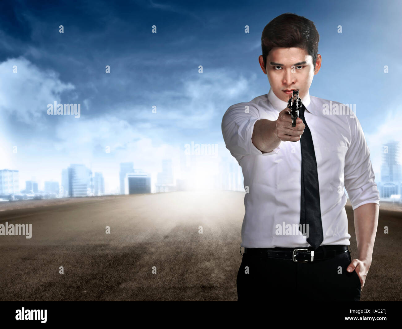 Businessman holding pointing gun hi-res stock photography and images ...