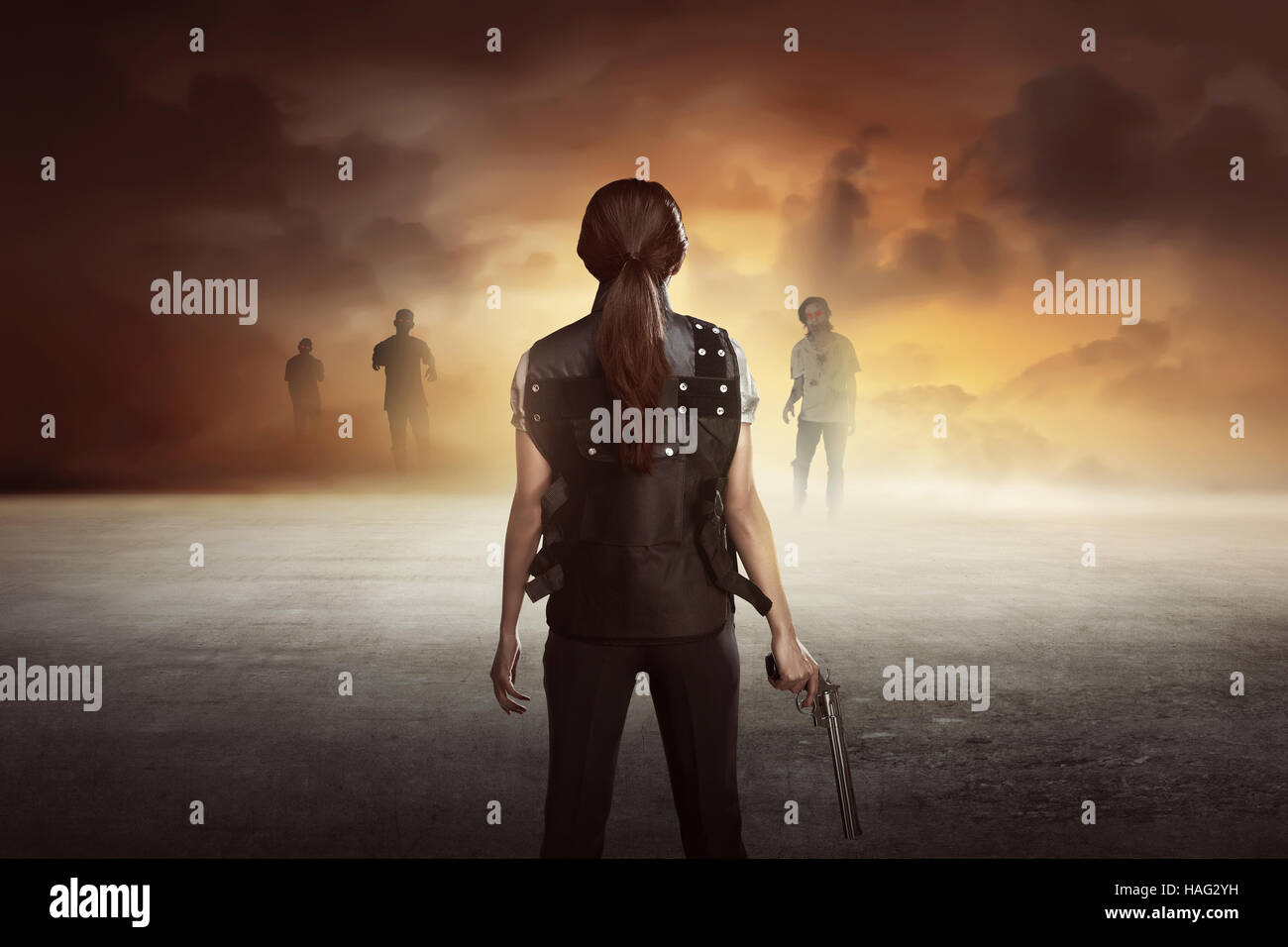 Brave woman with shoot the zombies on the street Stock Photo - Alamy