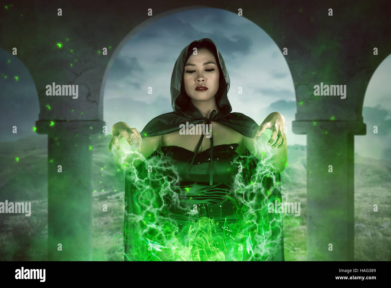 Asian Witch Woman Casting Spell With Concentration The Green Light Out