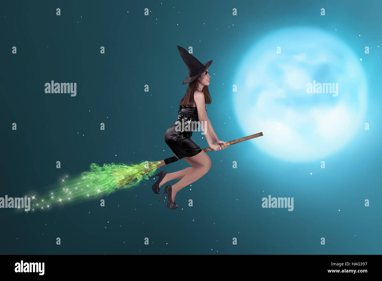 Pretty asian witch woman flying on the sky in the night with full moon ...