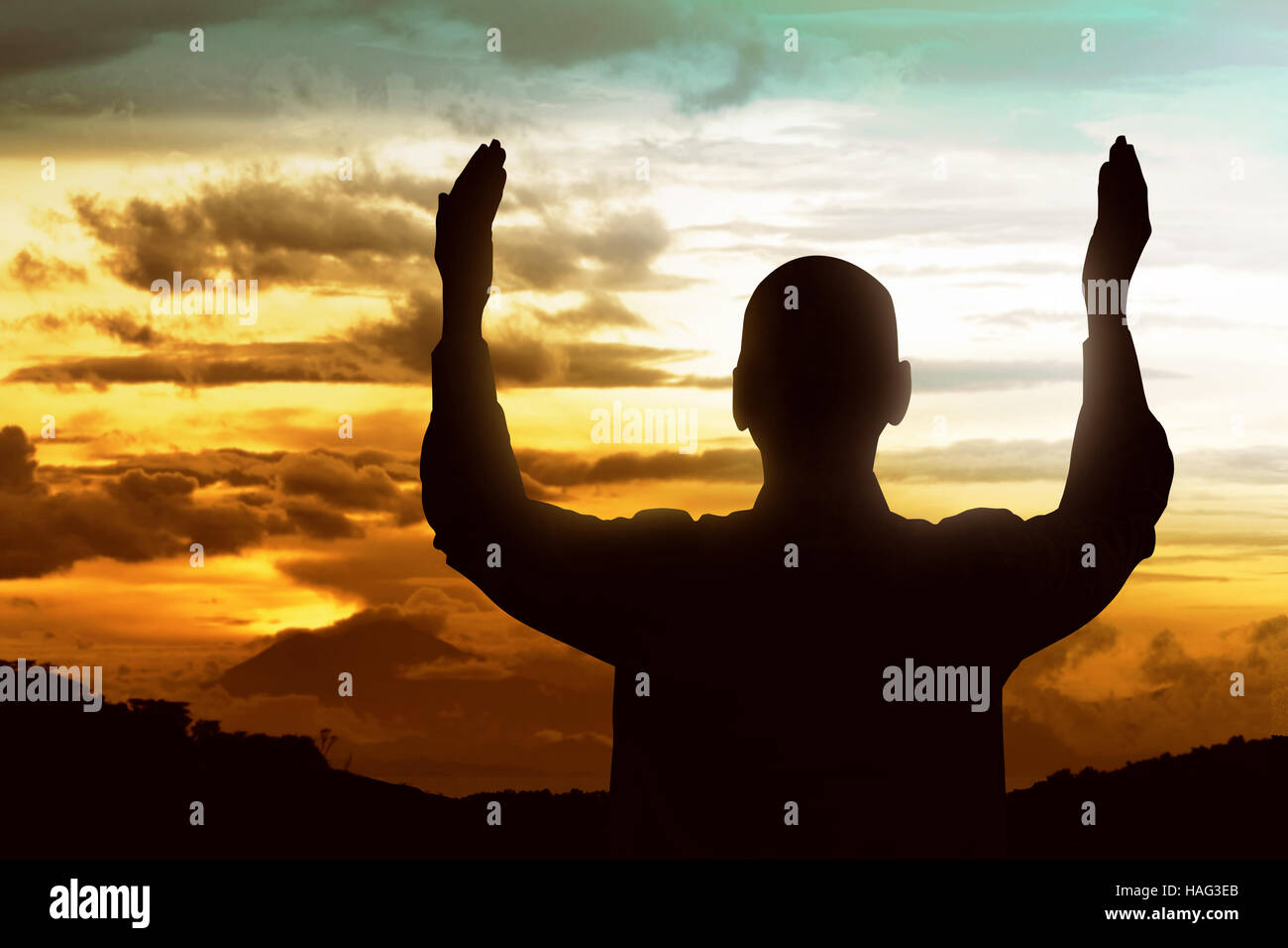 Back view of young muslim man praying Stock Photo - Alamy