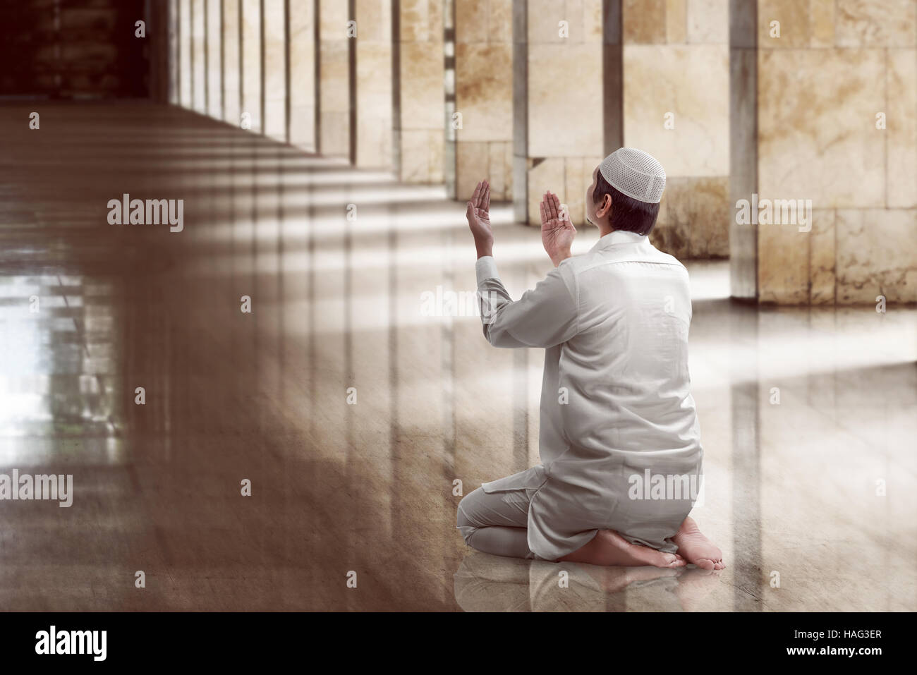 Religious muslim man praying inside the mosque Stock Photo - Alamy