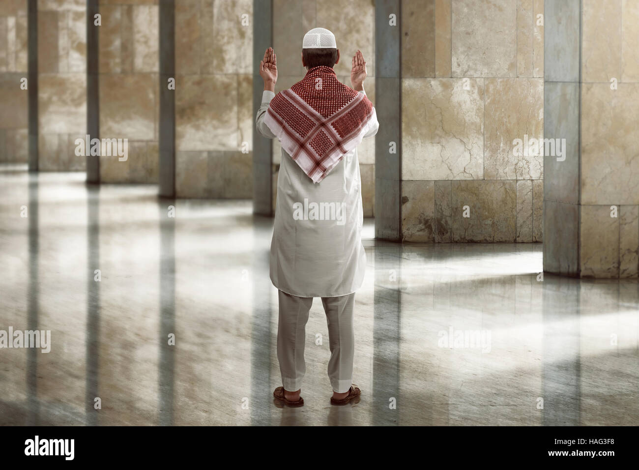 Back view of young muslim man praying Stock Photo - Alamy