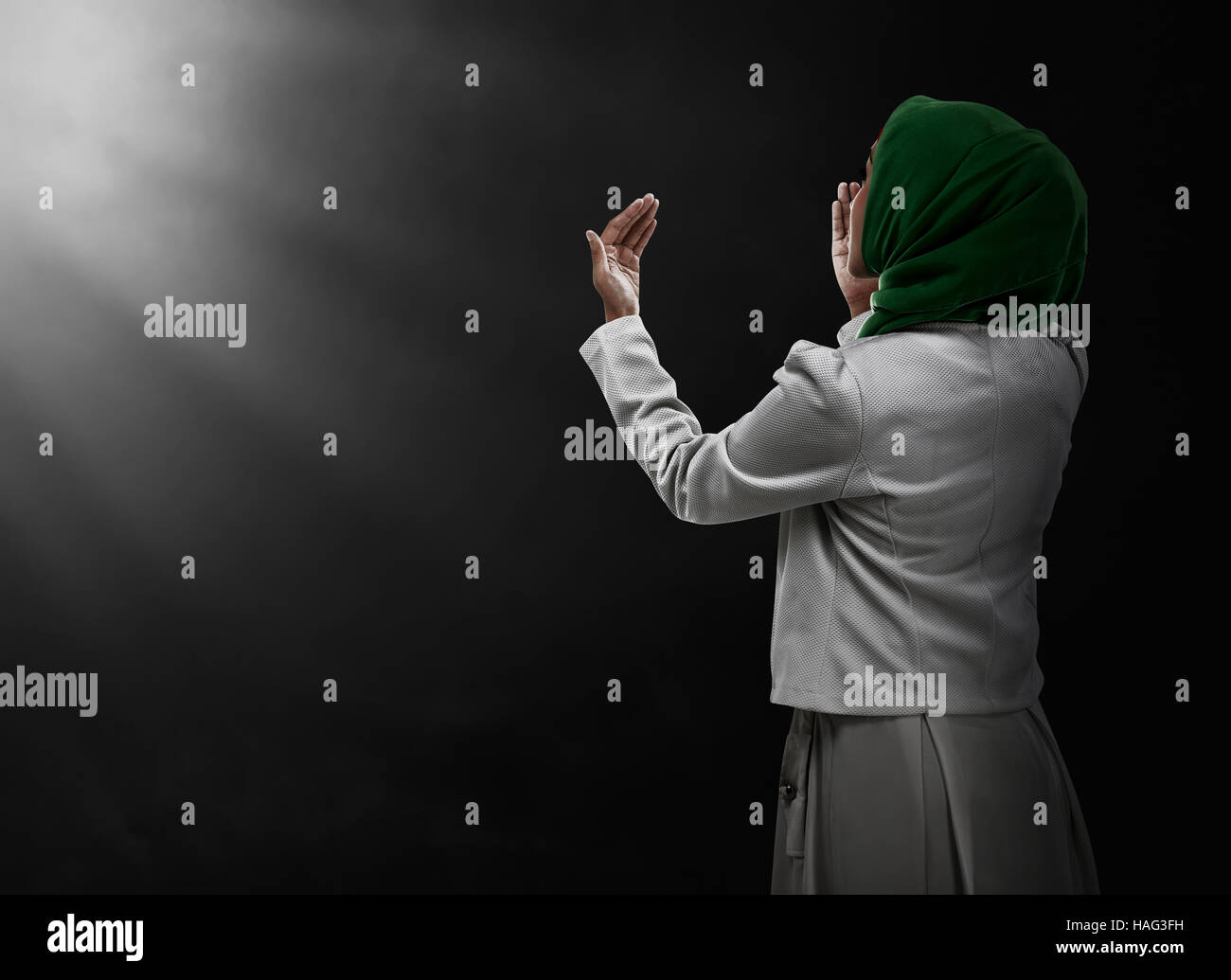 Back view of muslim woman praying wearing hijab Stock Photo - Alamy