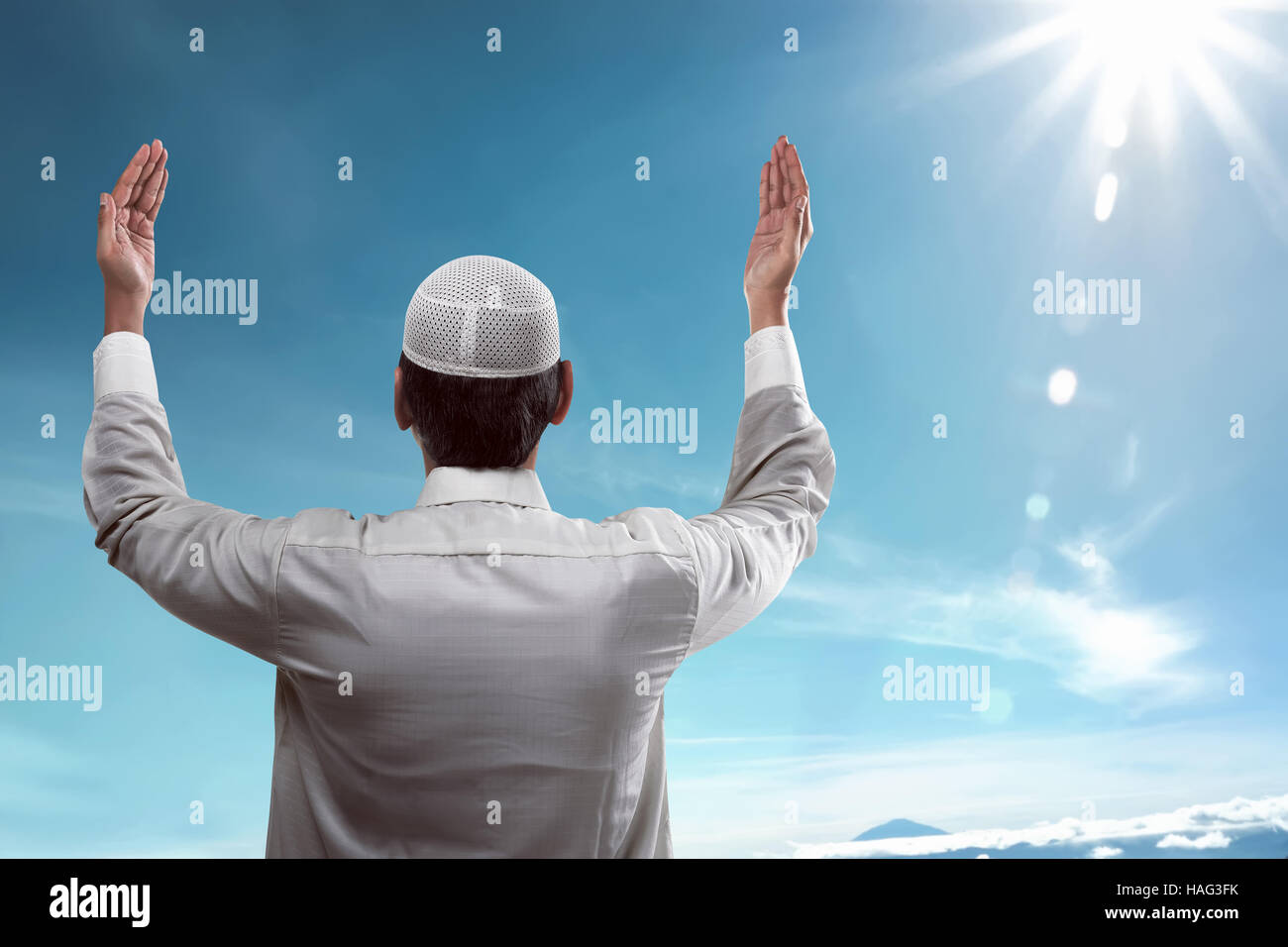Back view of young muslim man praying Stock Photo - Alamy
