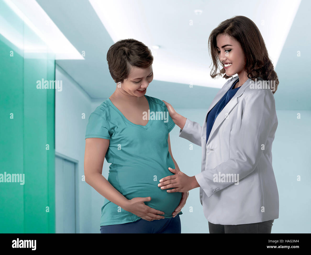 Asian woman check up pregnancy with female doctor Stock Photo - Alamy
