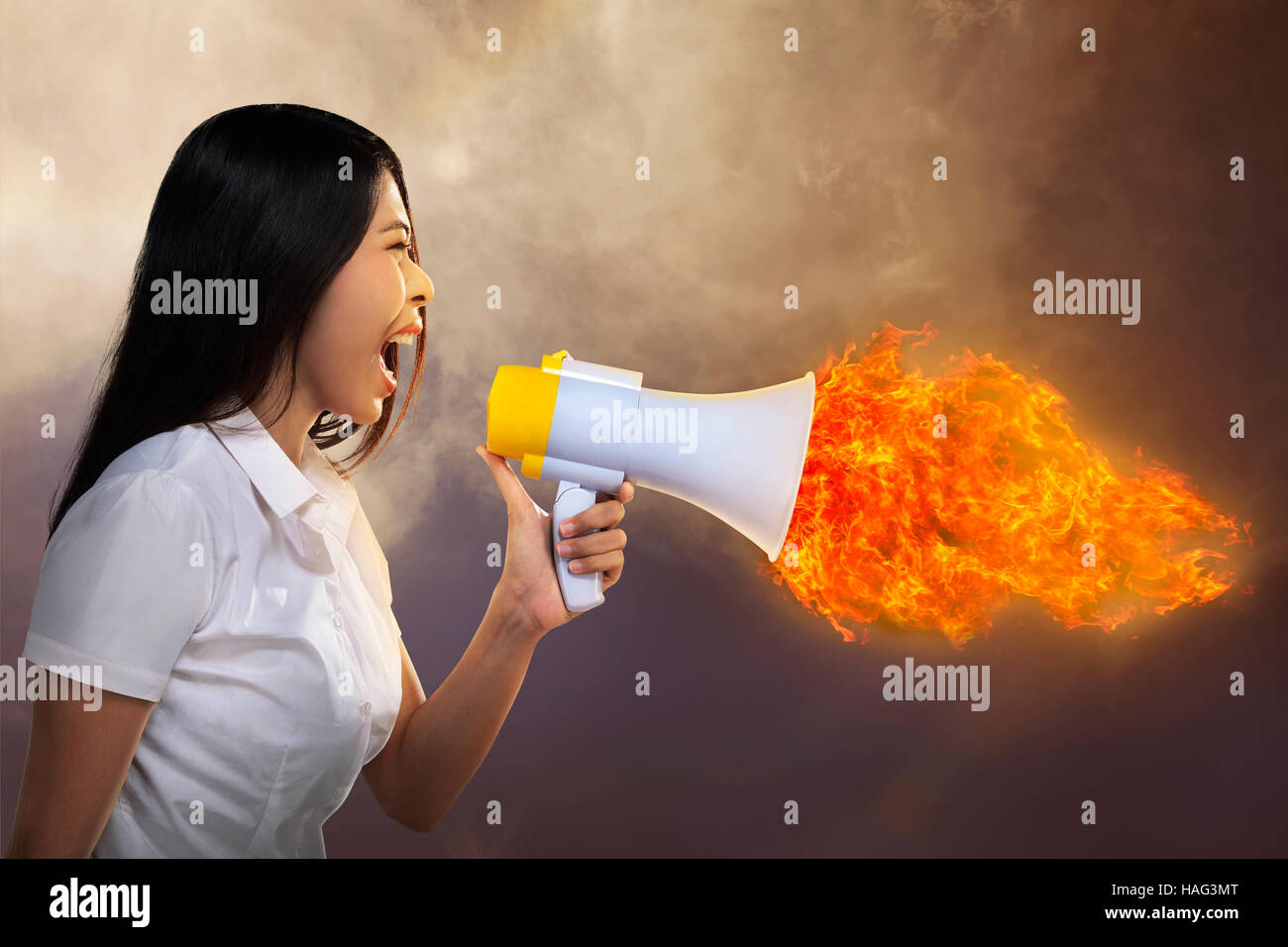 Asian business woman with a megaphone shouting megaphone on fire Stock ...